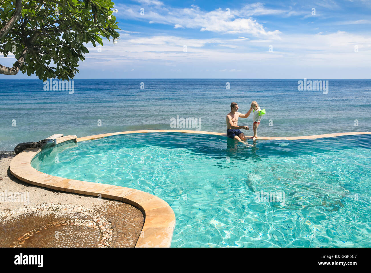 Children swimming in an infinity pool hi-res stock photography and ...