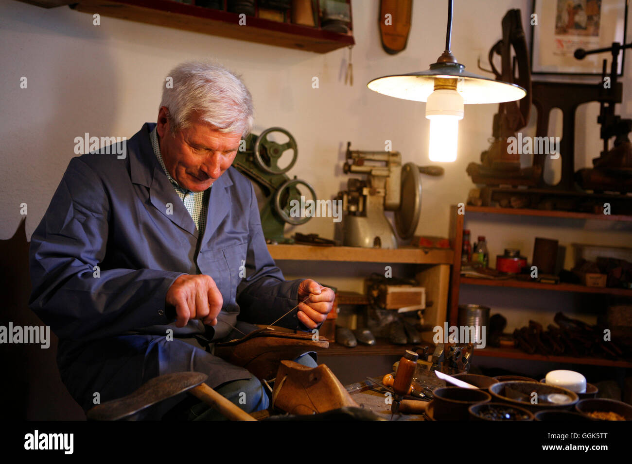 A shoemaker displaying his traditional craft at Lebendiges Museum ...