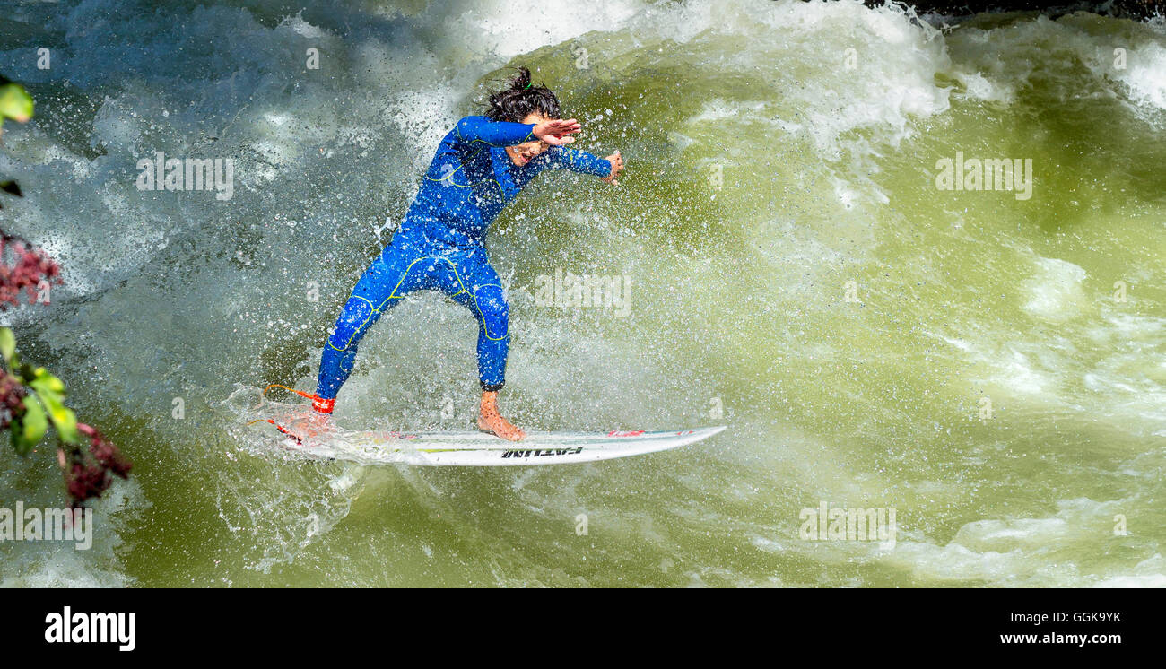 Surfer on the Eisbach river in the English Gardens, Munich, Upper ...