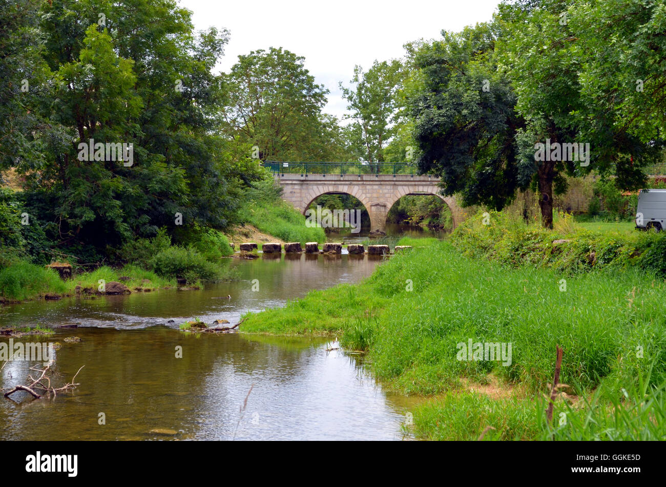 medieval stone bridge at a river in south france Stock Photo - Alamy