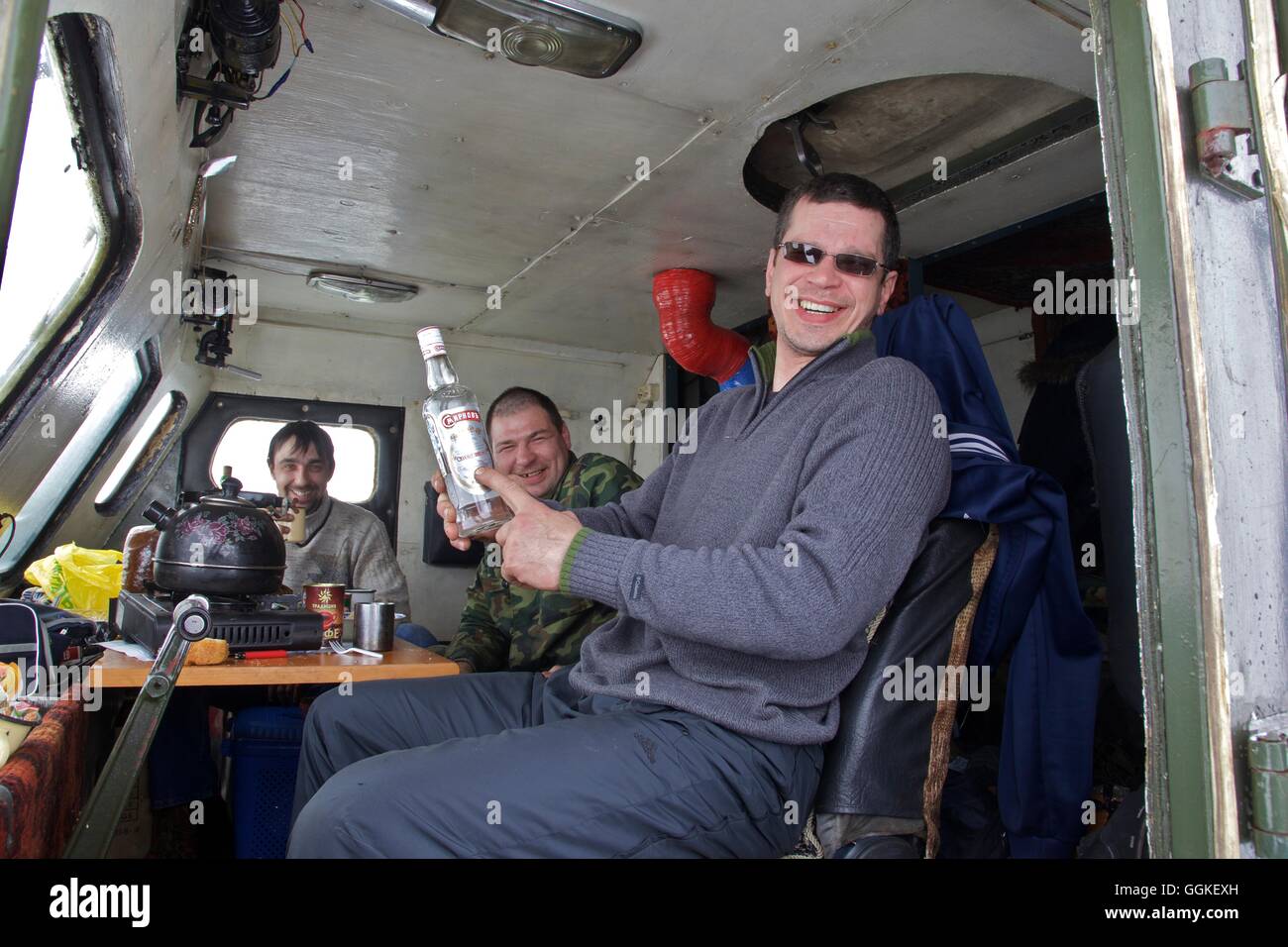 Three men in operators cab hi-res stock photography and images - Alamy