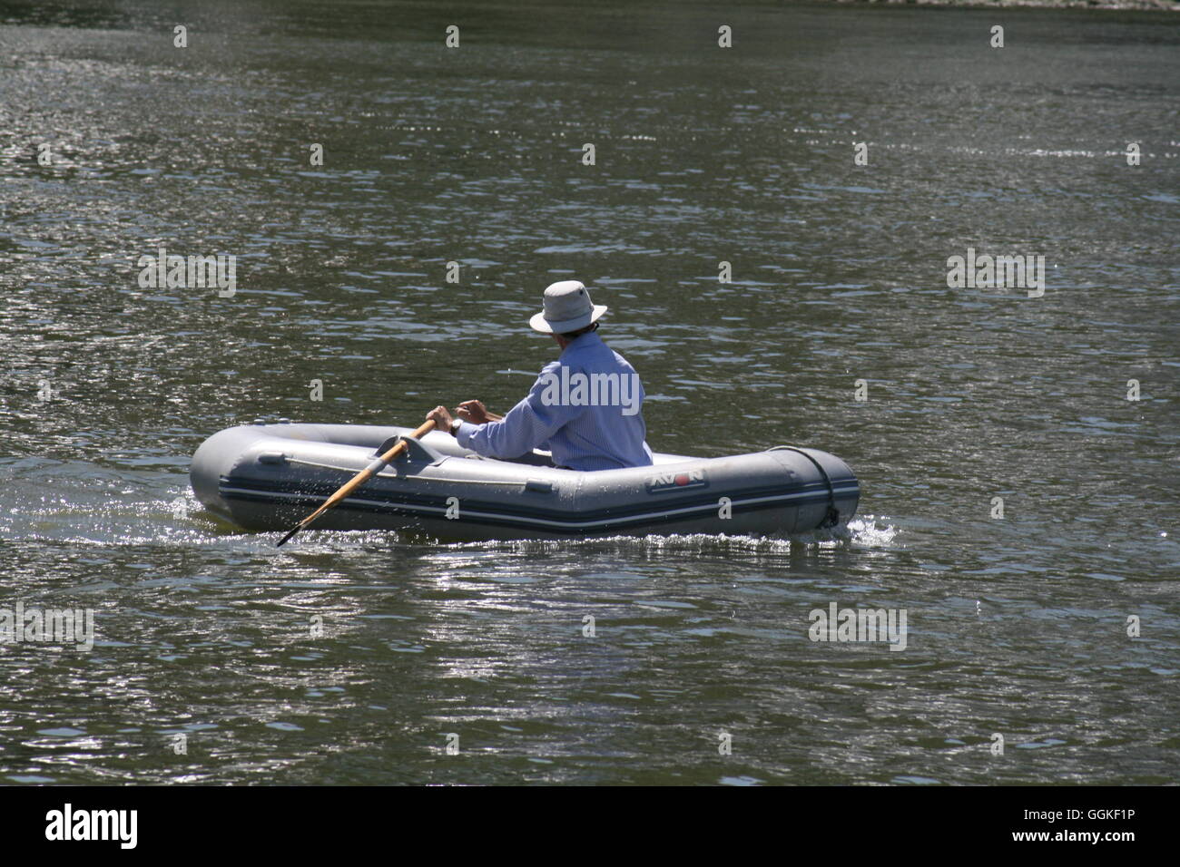 man in a row boat Stock Photo - Alamy