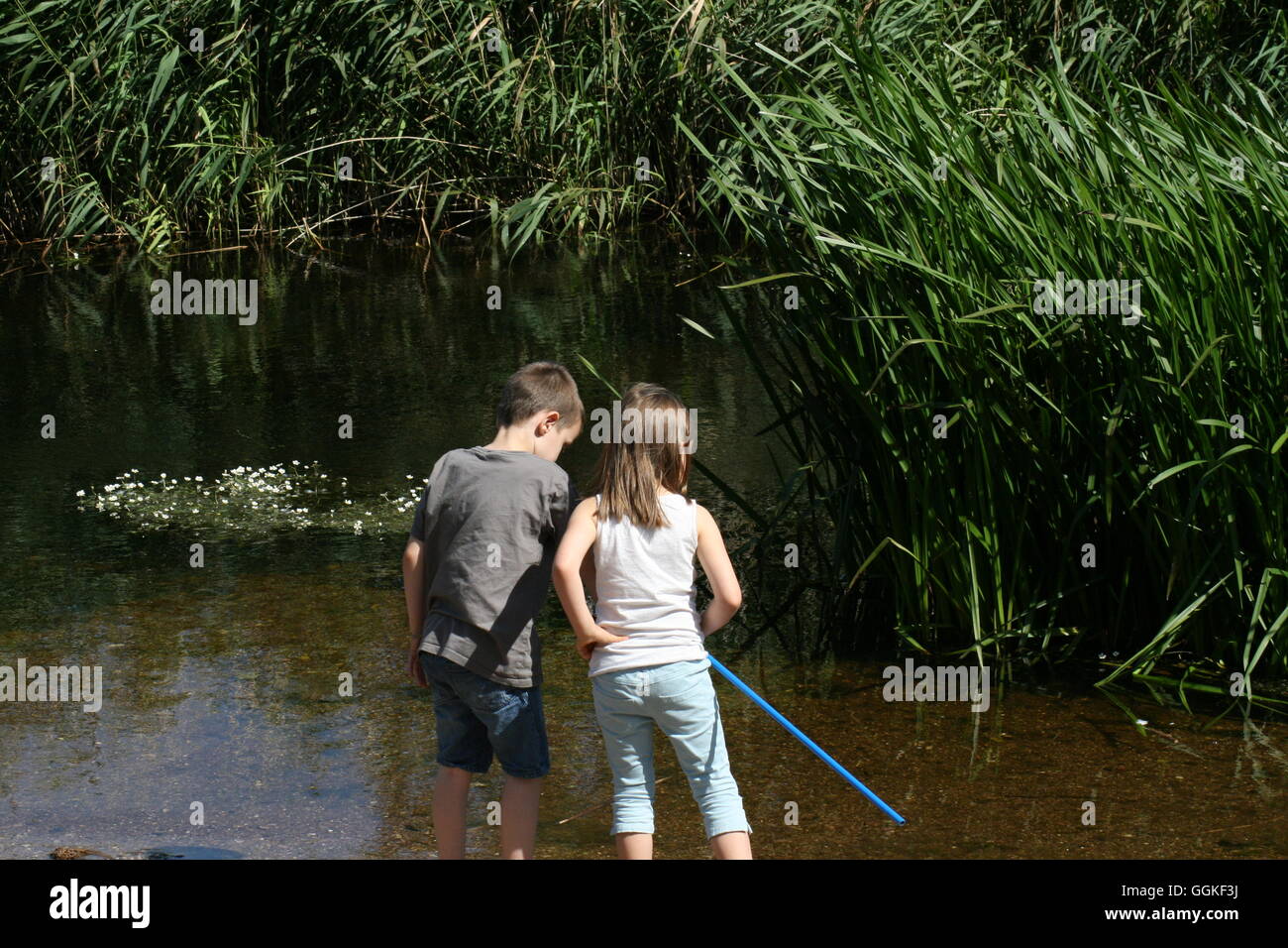 Children playing on river bank hi-res stock photography and images - Alamy