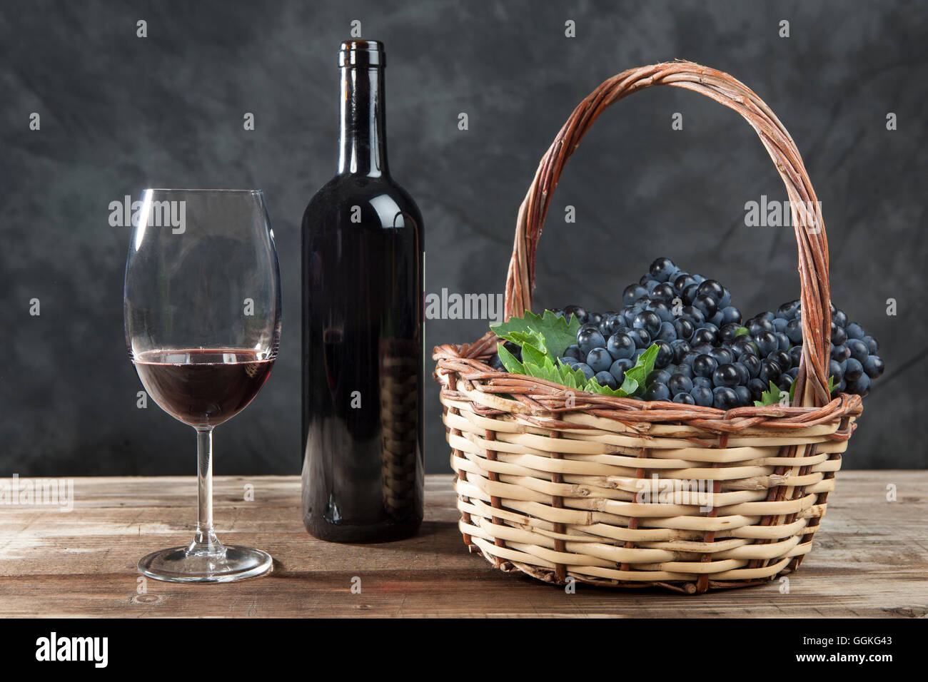 Red wine with grapes in a busket Stock Photo - Alamy