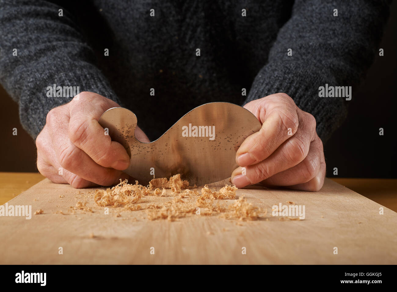 Woodworking tool. Carpenter saving wood with scraper blade Stock Photo ...