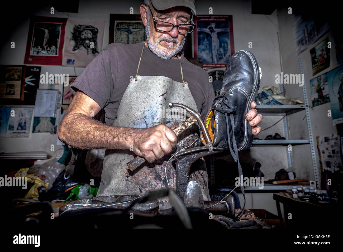 Adult male shoemender working own hi-res stock photography and images ...