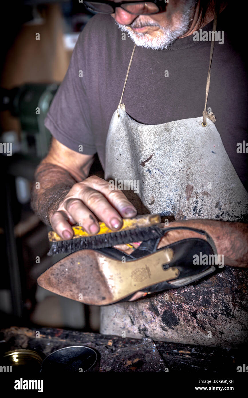 Adult male shoemender working own hi-res stock photography and images ...