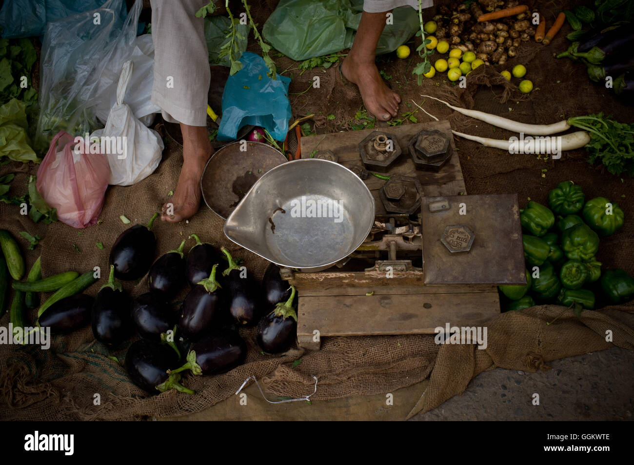 Feet of a vegetables street vendor in Amritsar, India. © Jordi Boixareu ...