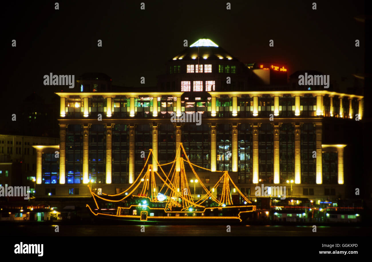 Night view of an illuminated colonial era building on the famous Bund ...