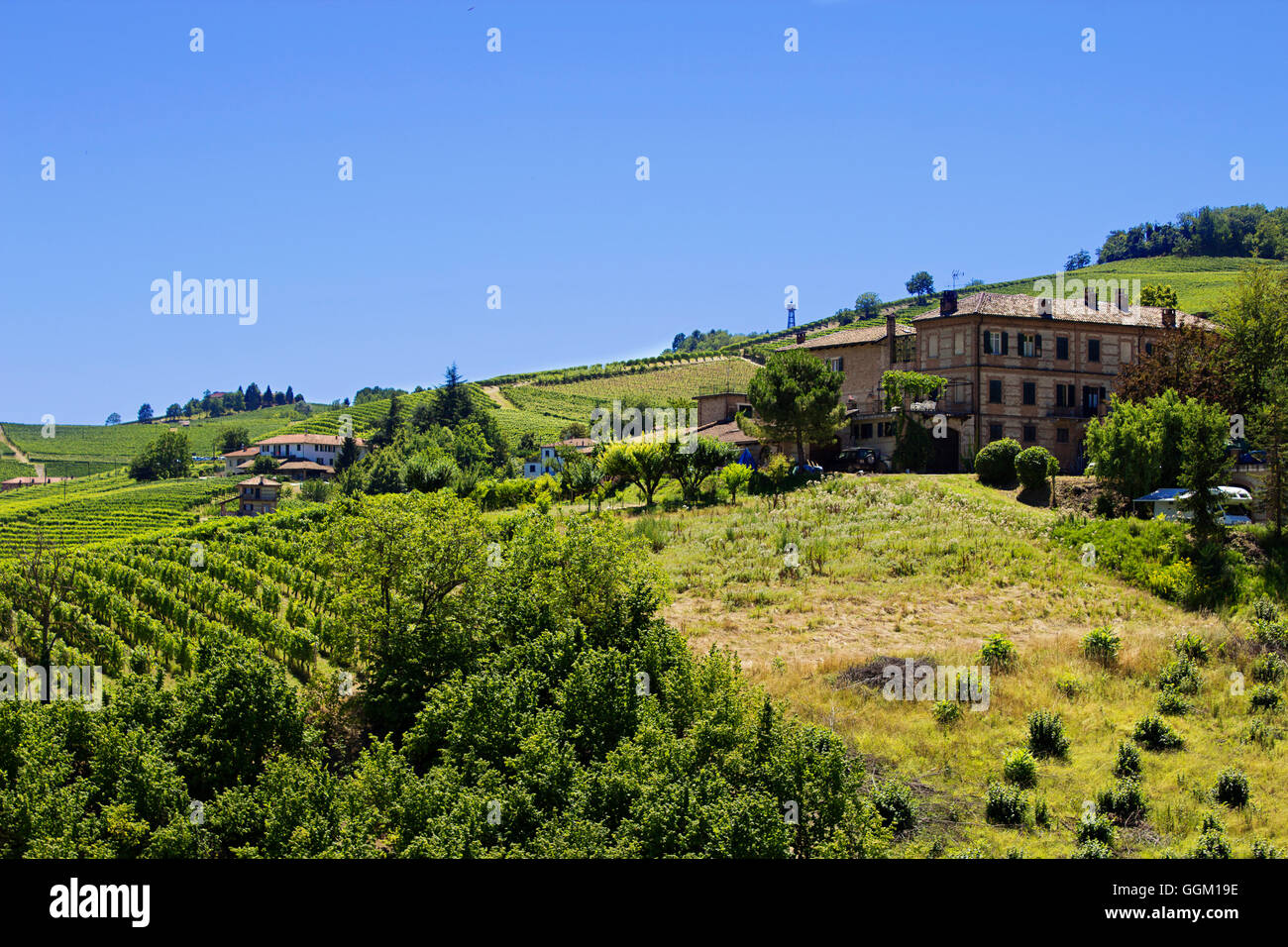 Landscape view of the well-known town of Barolo among green hills and ...