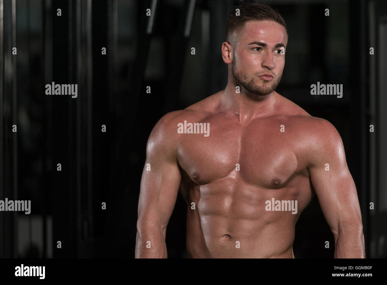 Bodybuilder Posing In Different Poses Demonstrating Their Muscles ...