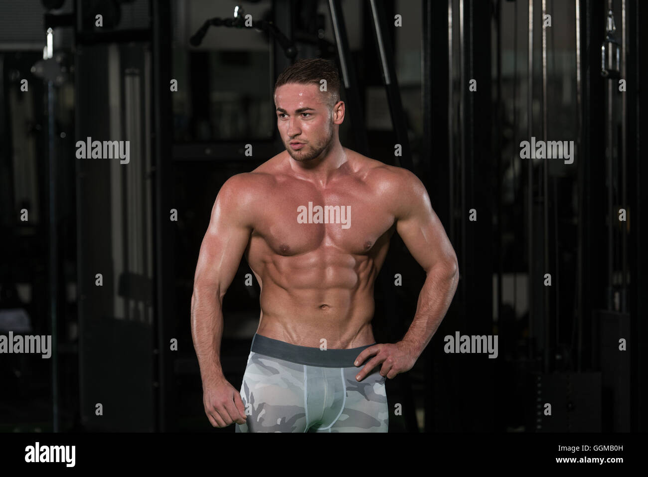 Portrait Of A Young Physically Fit Man Showing His Well Trained Body ...