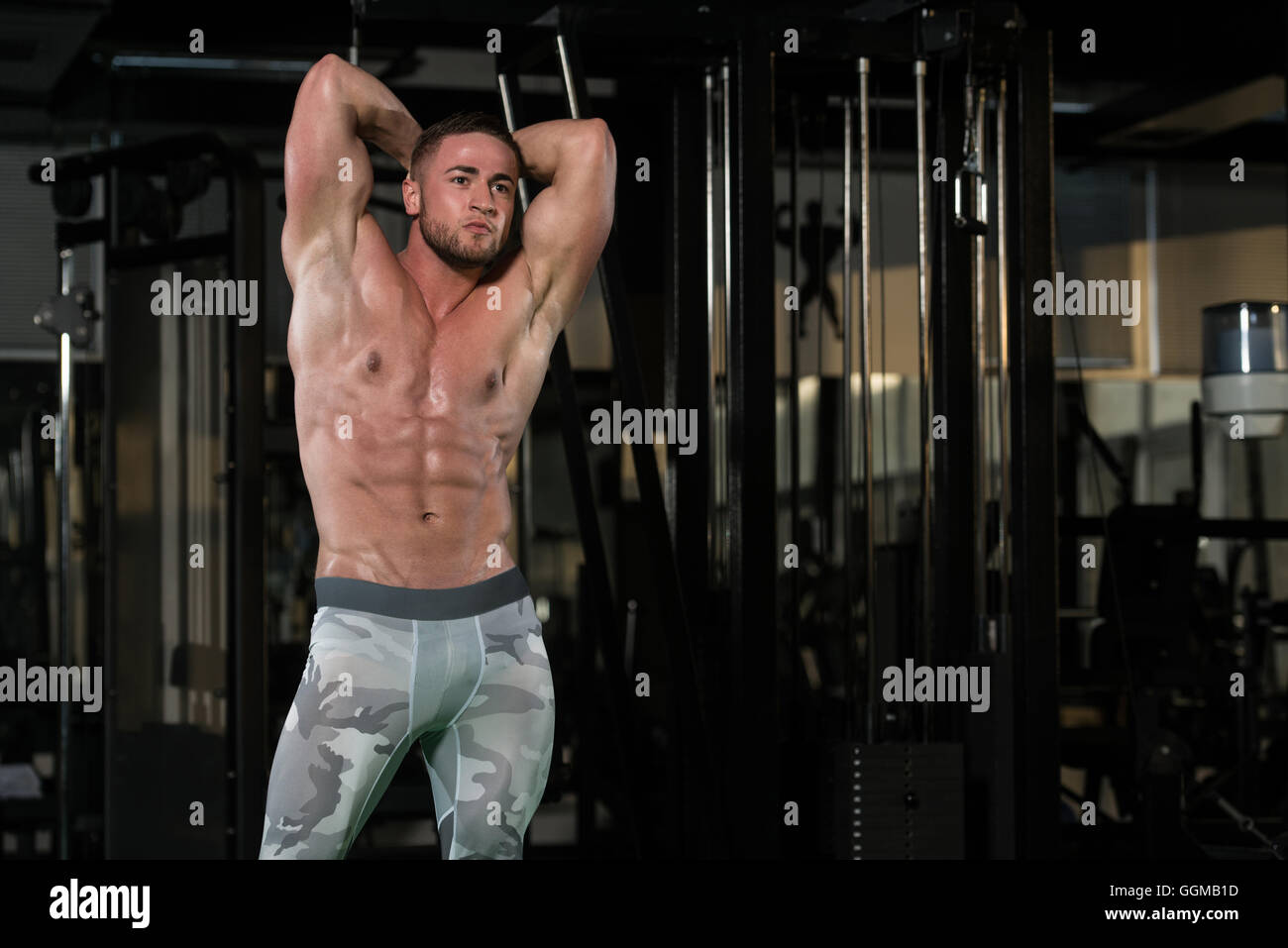 Bodybuilder Posing In Different Poses Demonstrating Their Muscles ...