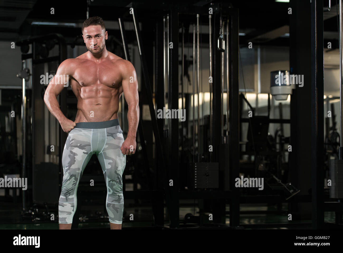 Bodybuilder Posing In Different Poses Demonstrating Their Muscles ...