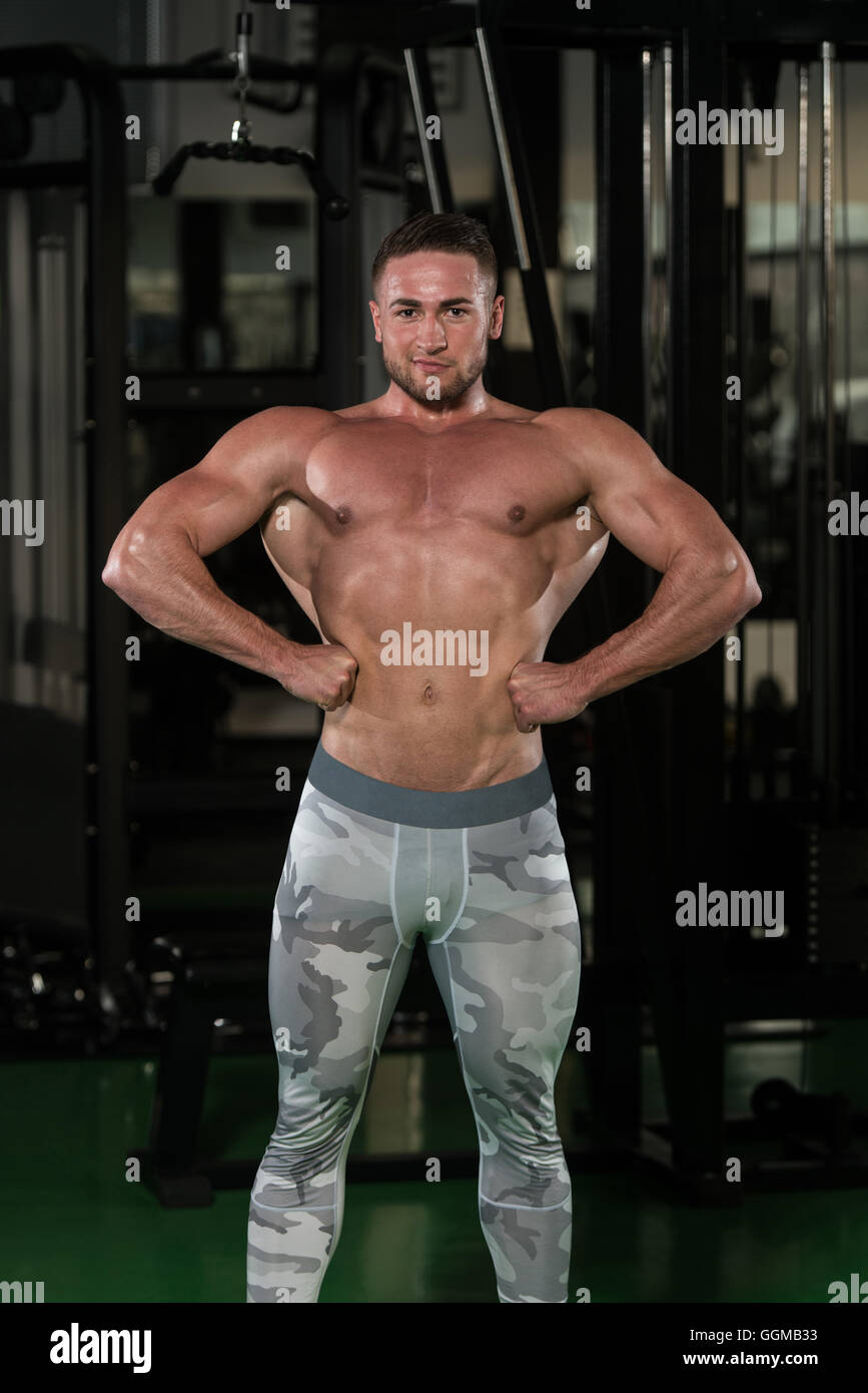 Bodybuilder Posing In Different Poses Demonstrating Their Muscles ...