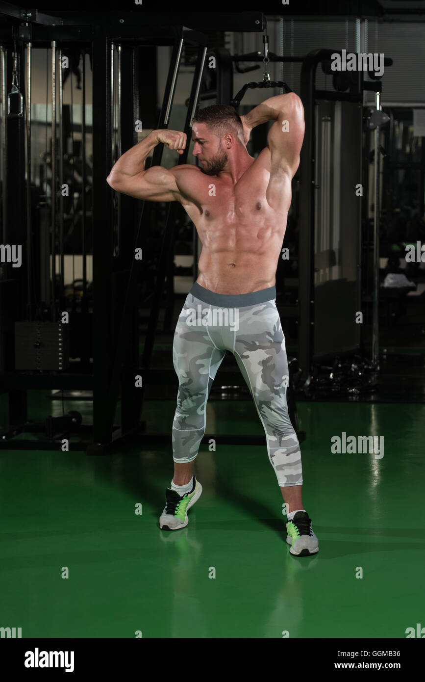 Bodybuilder Posing In Different Poses Demonstrating Their Muscles ...