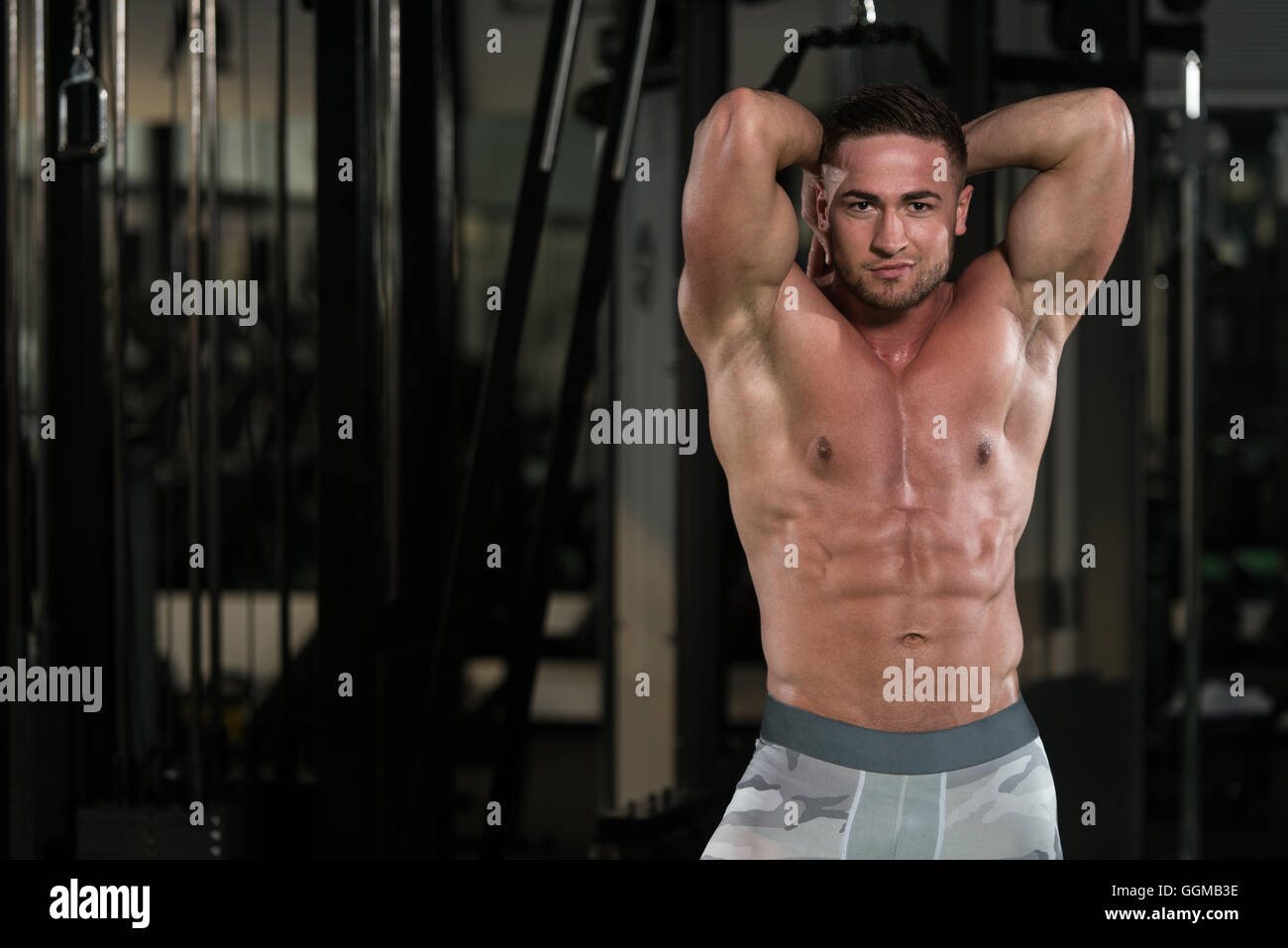 Bodybuilder Posing In Different Poses Demonstrating Their Muscles ...