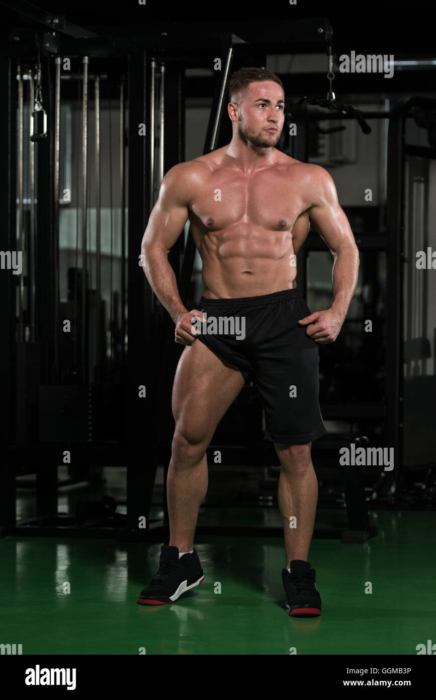 Bodybuilder Posing In Different Poses Demonstrating Their Muscles ...