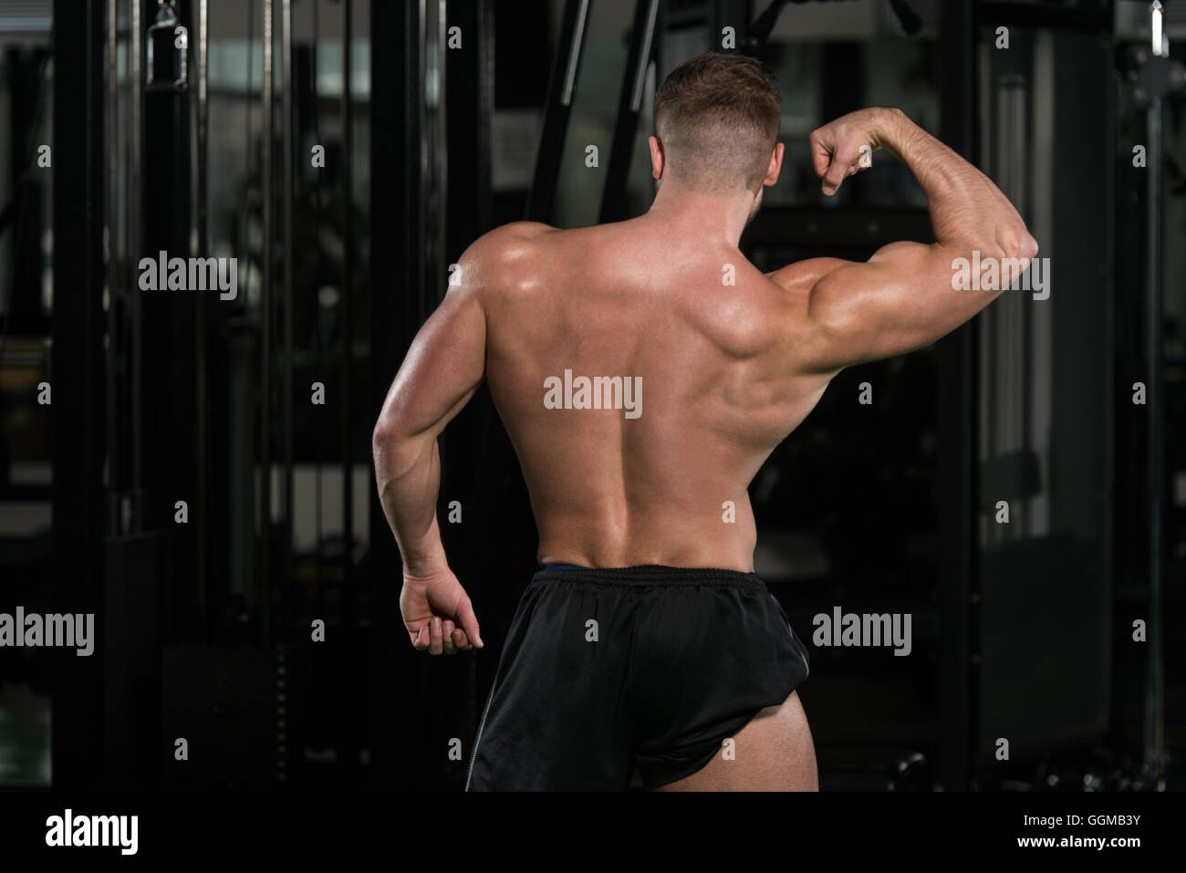 Bodybuilder Posing In Different Poses Demonstrating Their Muscles ...