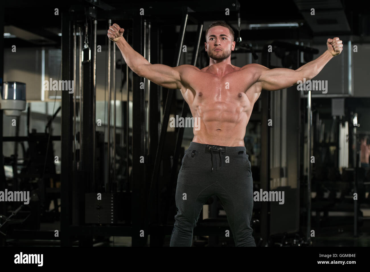 Bodybuilder Posing In Different Poses Demonstrating Their Muscles ...