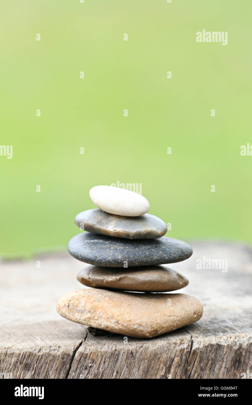 Balance Stones stacked to pyramid in the soft green background to Spa ...