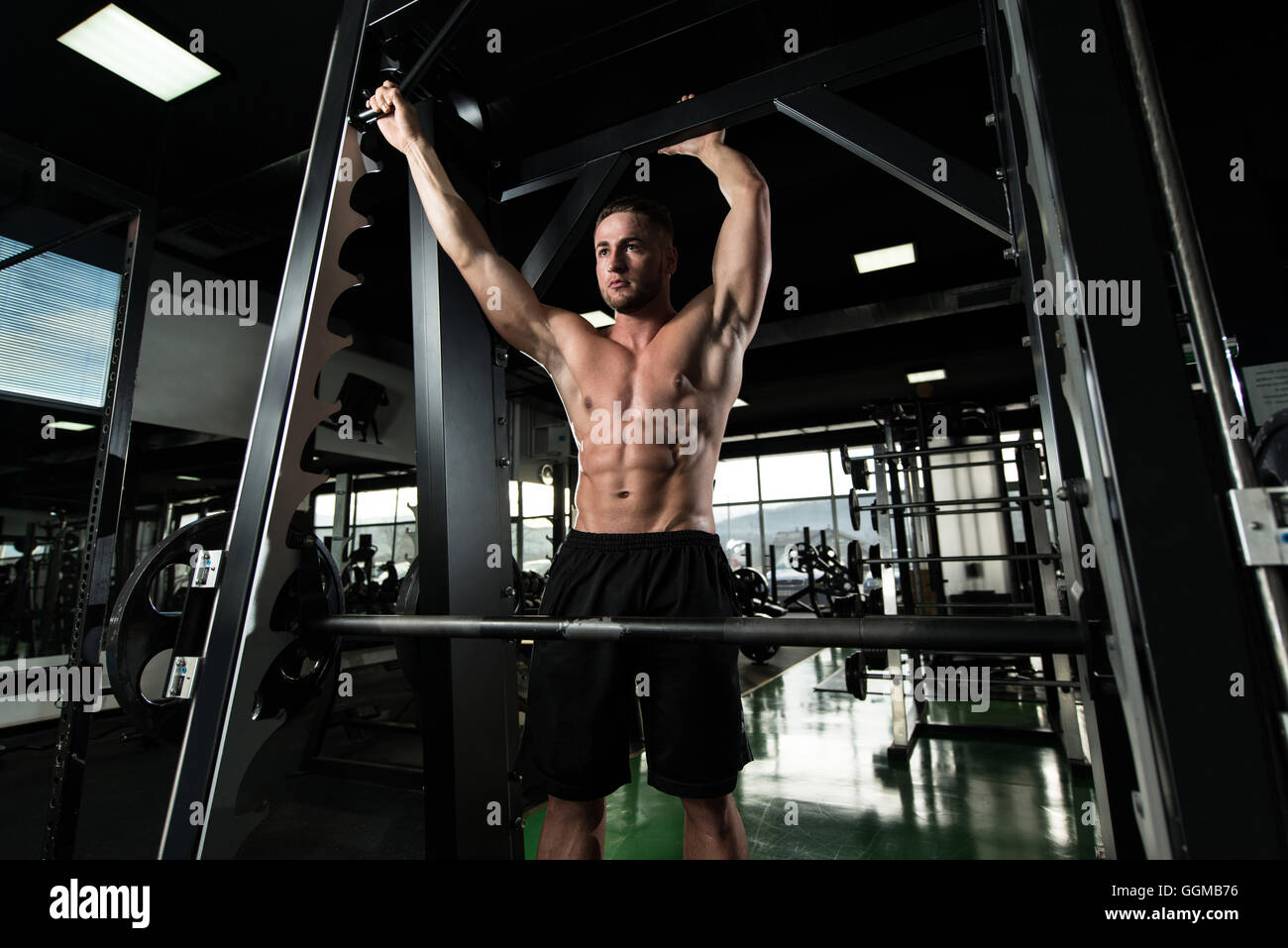 Portrait Of A Young Physically Fit Man Making Most Muscular Pose ...