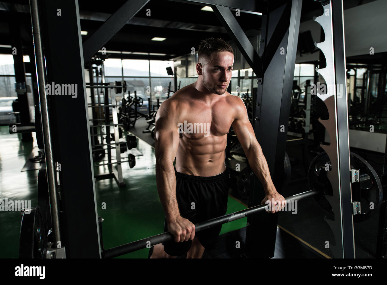 Portrait Of A Young Physically Fit Man Making Most Muscular Pose ...