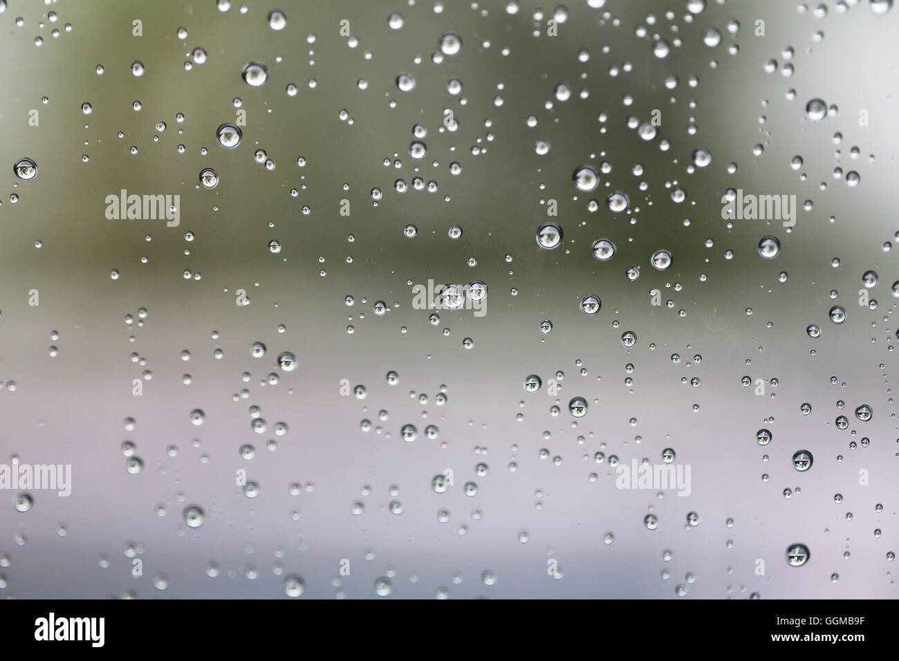 Drop of water for the background on glass car window to abstract design ...