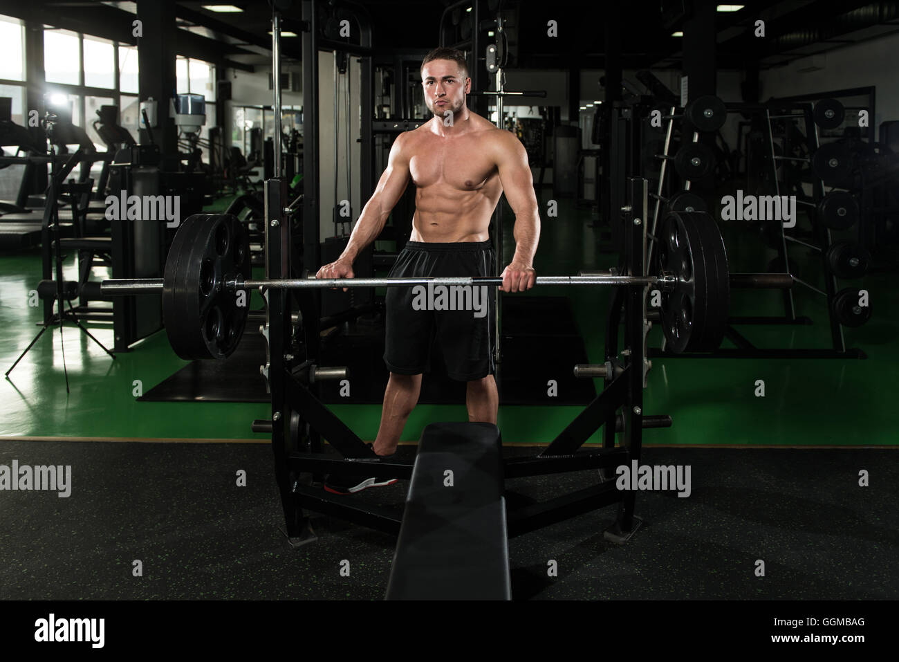 Portrait Of A Young Physically Fit Man Making Most Muscular Pose ...