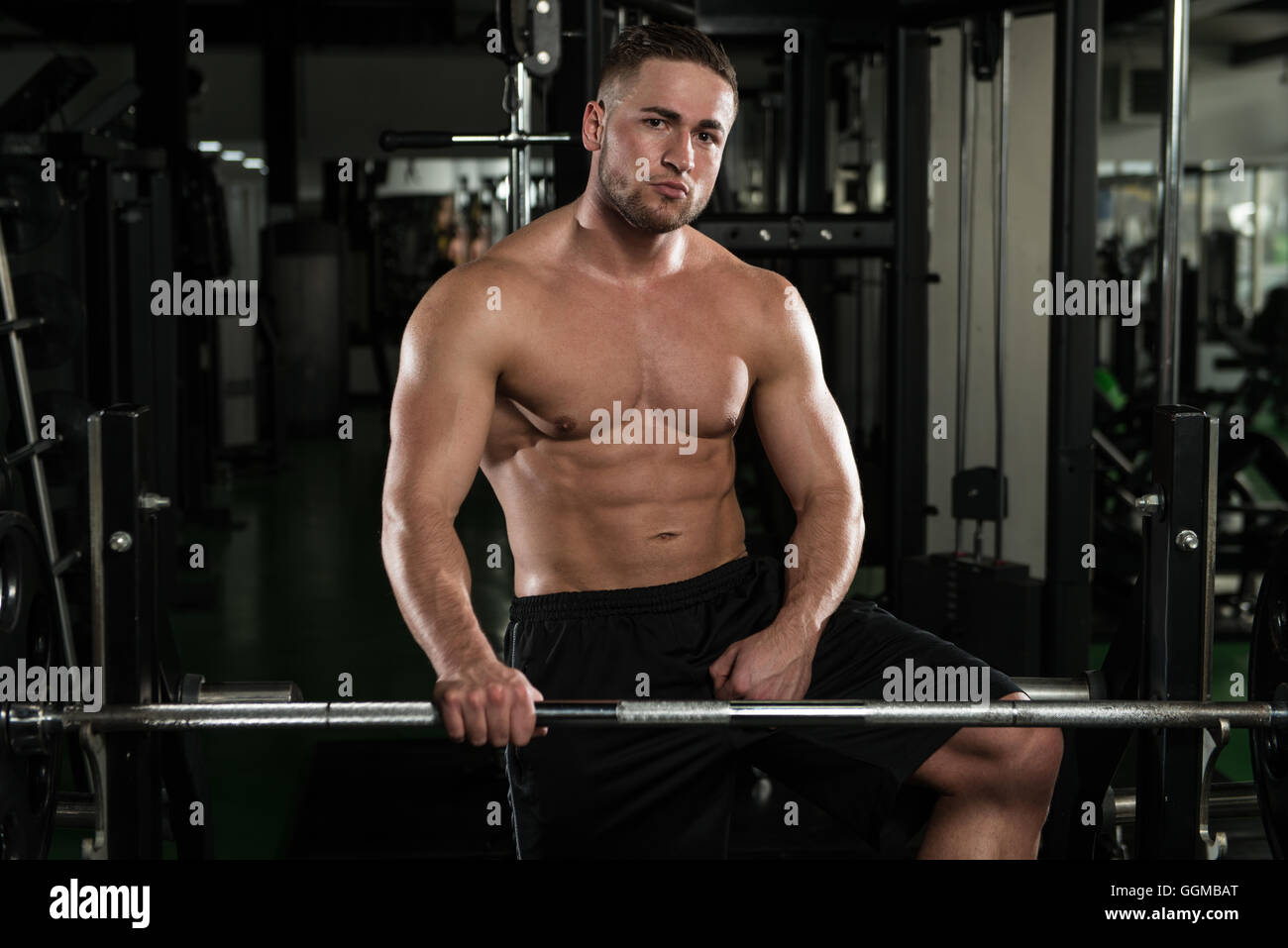 Portrait Of A Young Physically Fit Man Making Most Muscular Pose ...