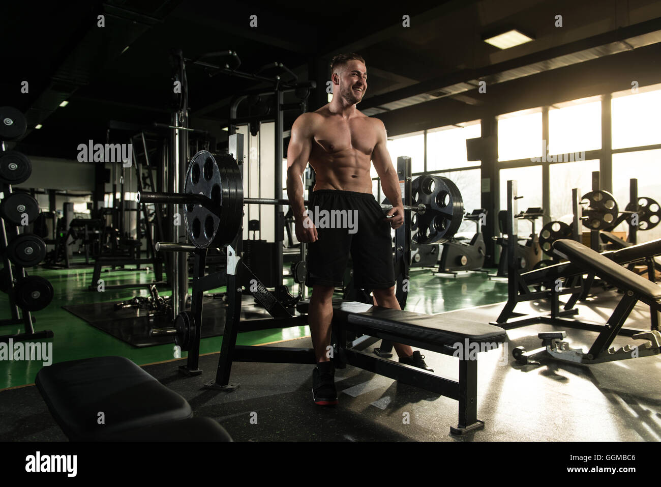 Portrait Of A Young Physically Fit Man Making Most Muscular Pose ...