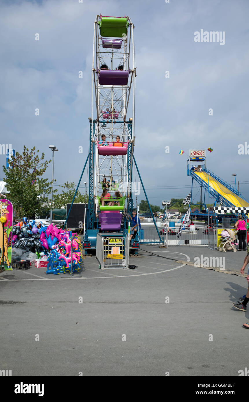 Ferris wheel at local country fair and carnival. "Editorial Use Only ...