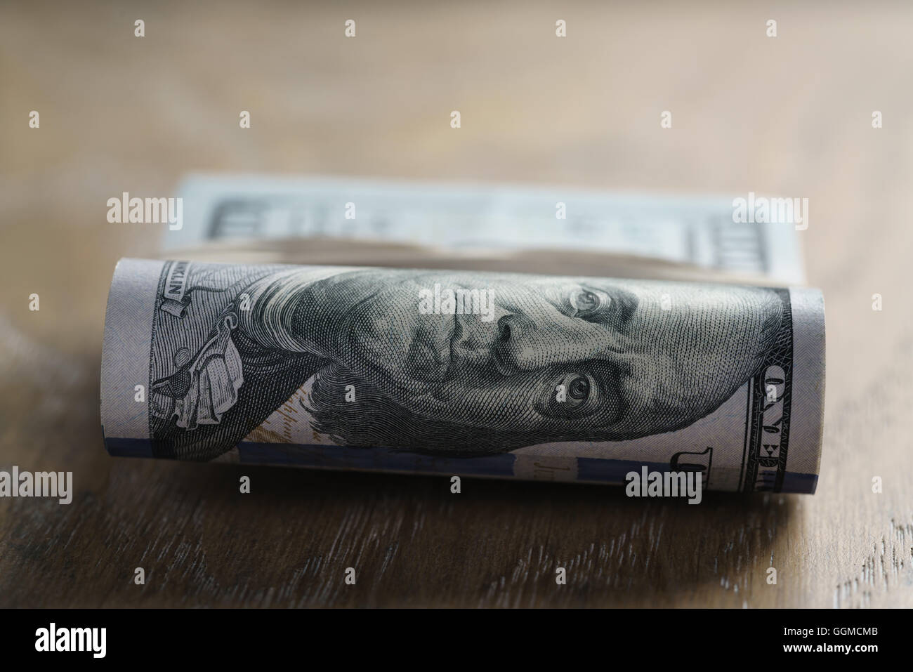bunch of dollars on oak wood table Stock Photo - Alamy
