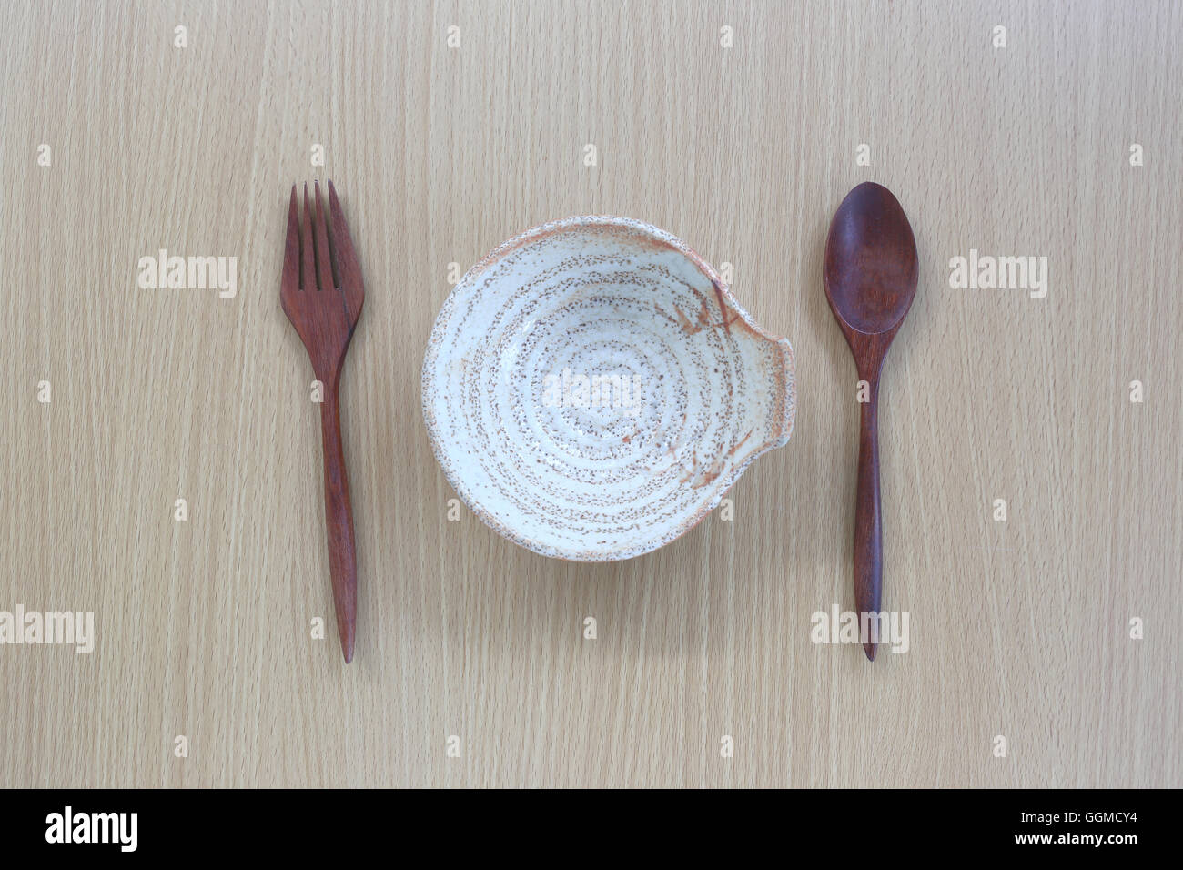 Wooden spoon,fork and dish in top view on wood background for design ...