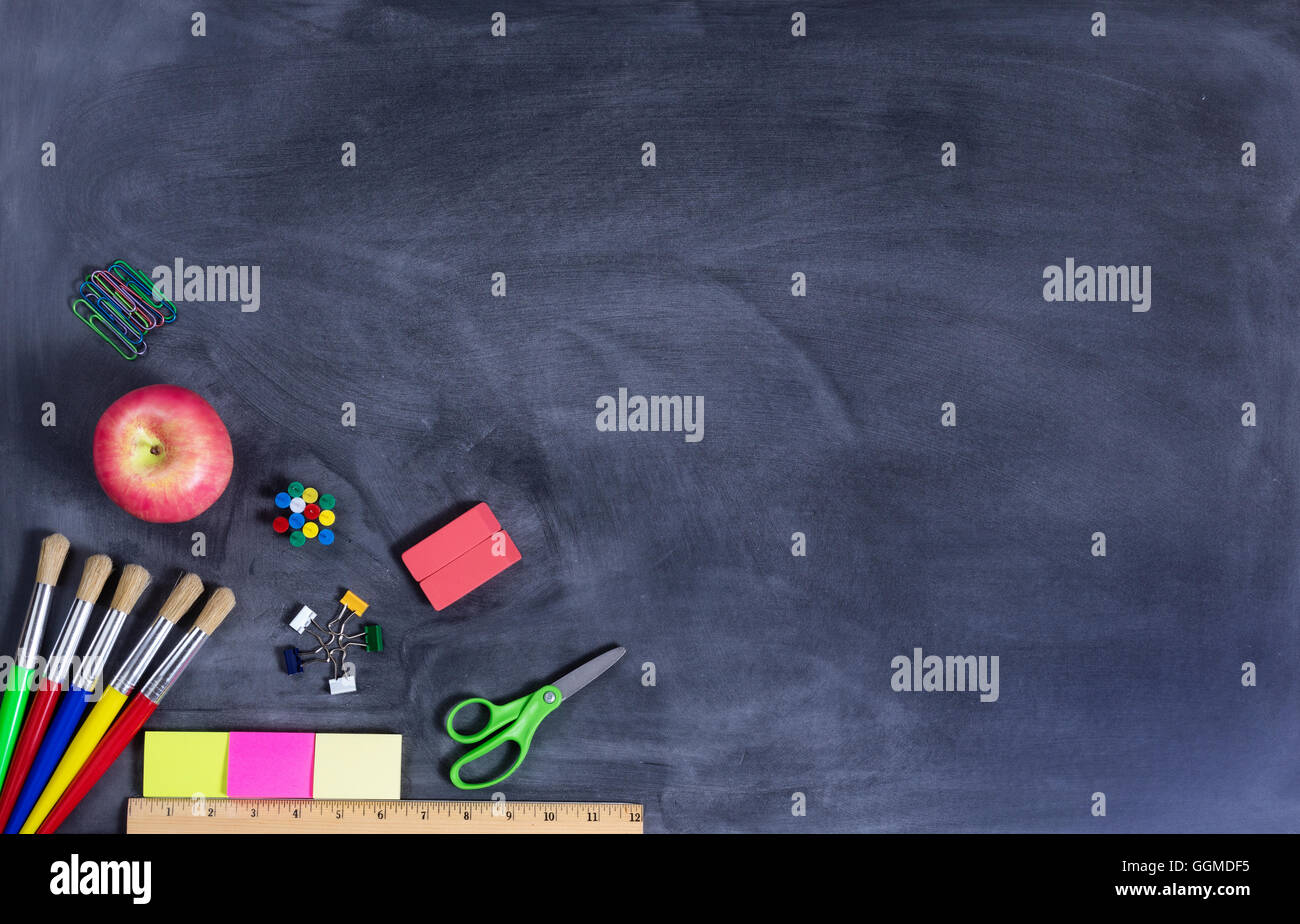 Overhead view of back to school supplies in lower left hand corner of ...