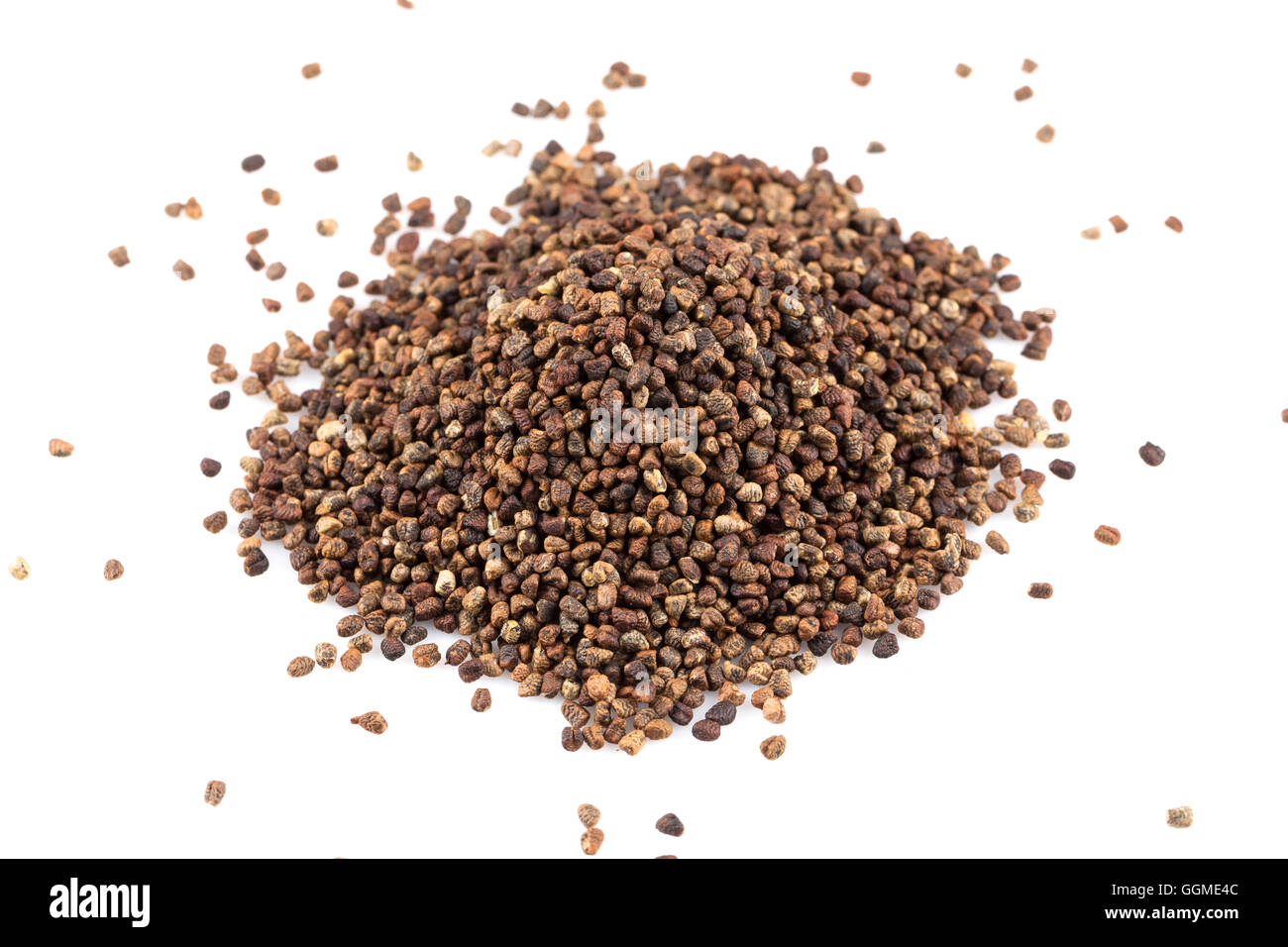 Decorticated cardamom seeds pile on a white background Stock Photo - Alamy