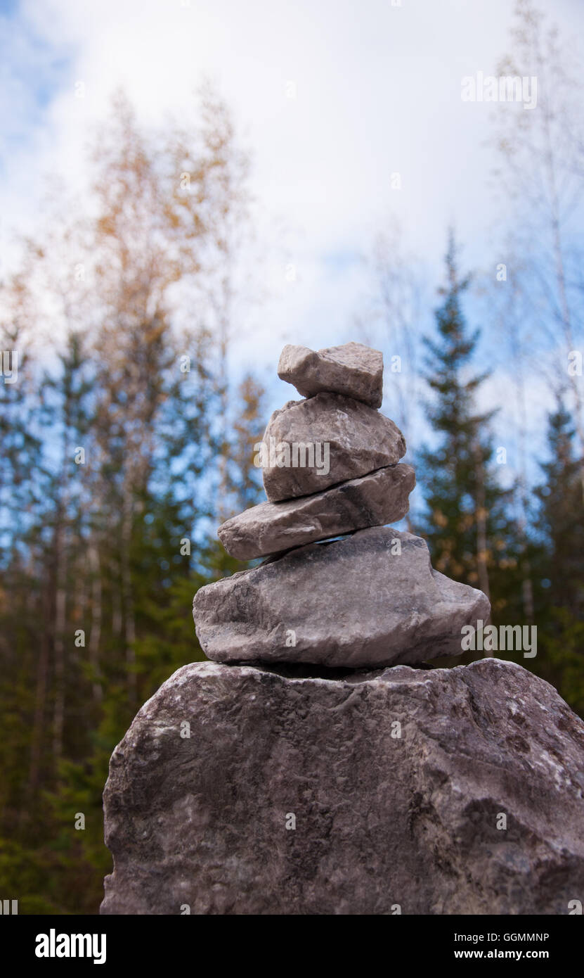 Pyramid of granite stones in the autumn park Stock Photo - Alamy
