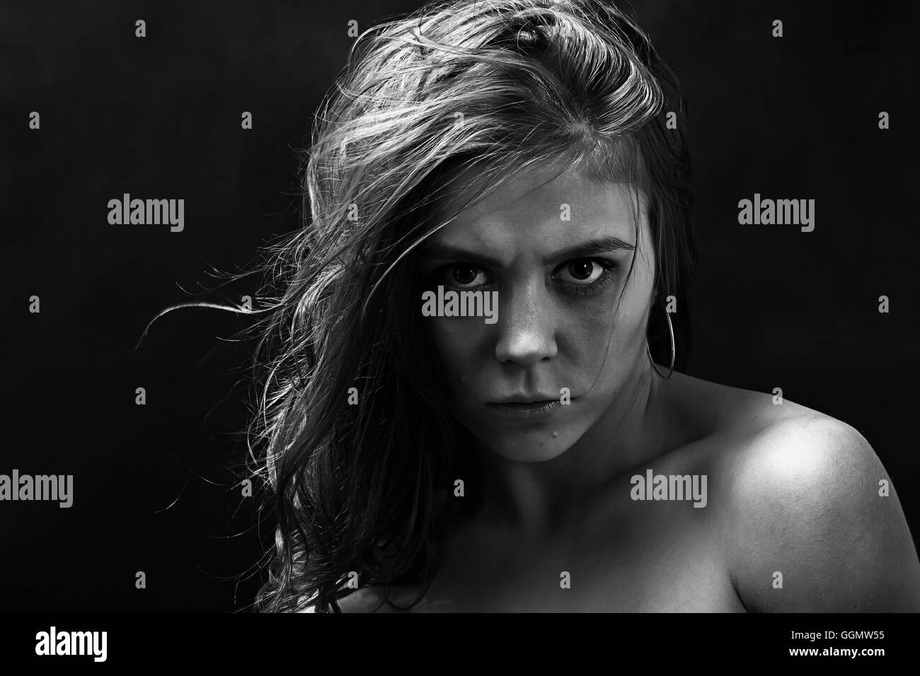 angry woman portrait on black background, monochrome image Stock Photo ...