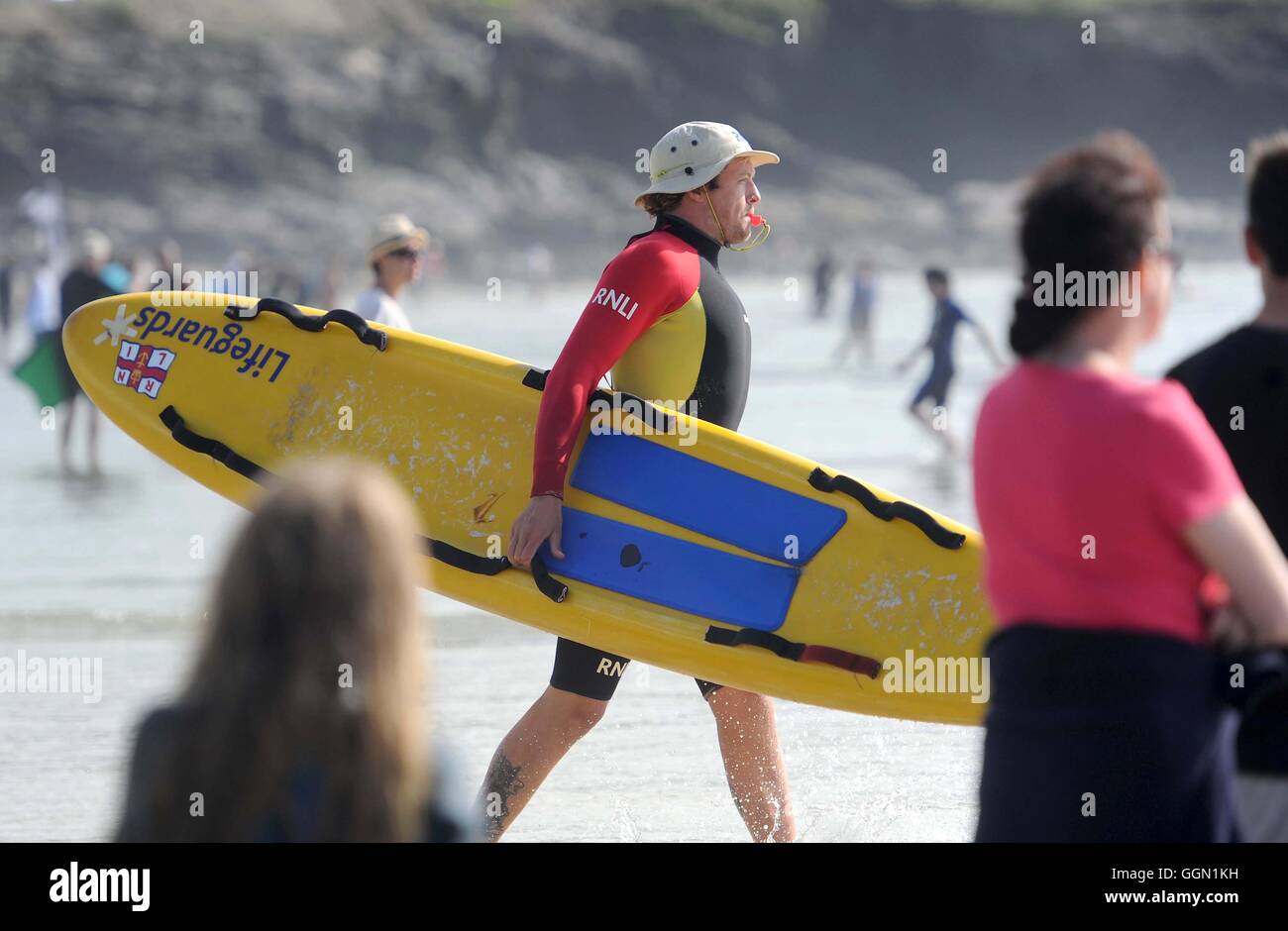 Beach lifeguard, RNLI lifeguards, Polzeath beach, Cornwall, UK Stock ...