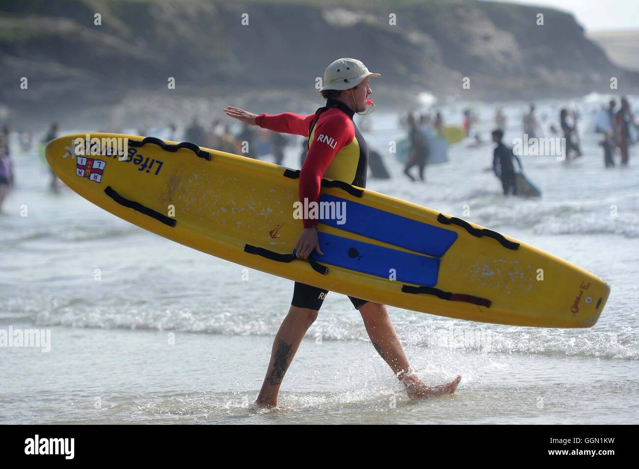 Beach lifeguard, RNLI lifeguards, Polzeath beach, Cornwall, UK Stock ...