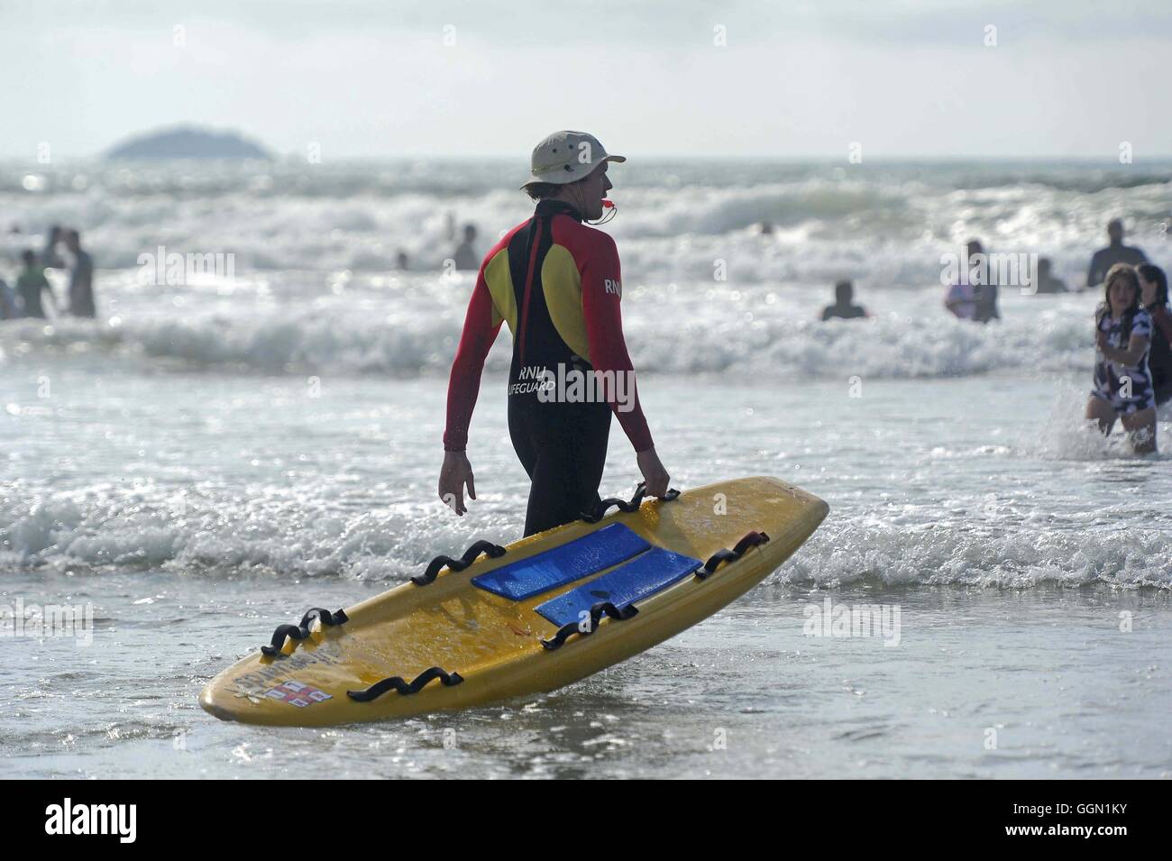 Beach lifeguard, RNLI lifeguards, Polzeath beach, Cornwall, UK Stock ...