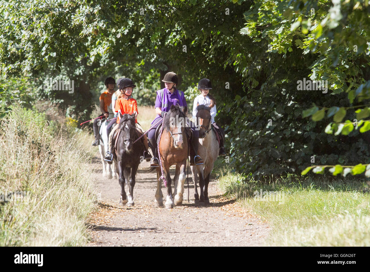 Wimbledon London, UK. 6th August 2016. Horse riders from the local ...
