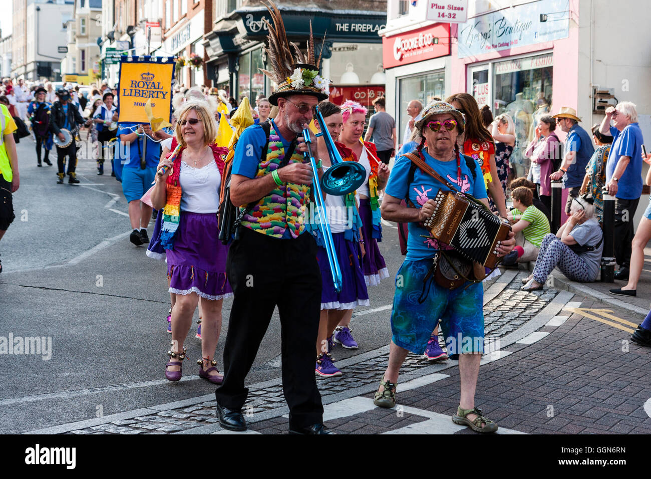 Two senior men marching in the parade for the Broadstairs Folk Week ...