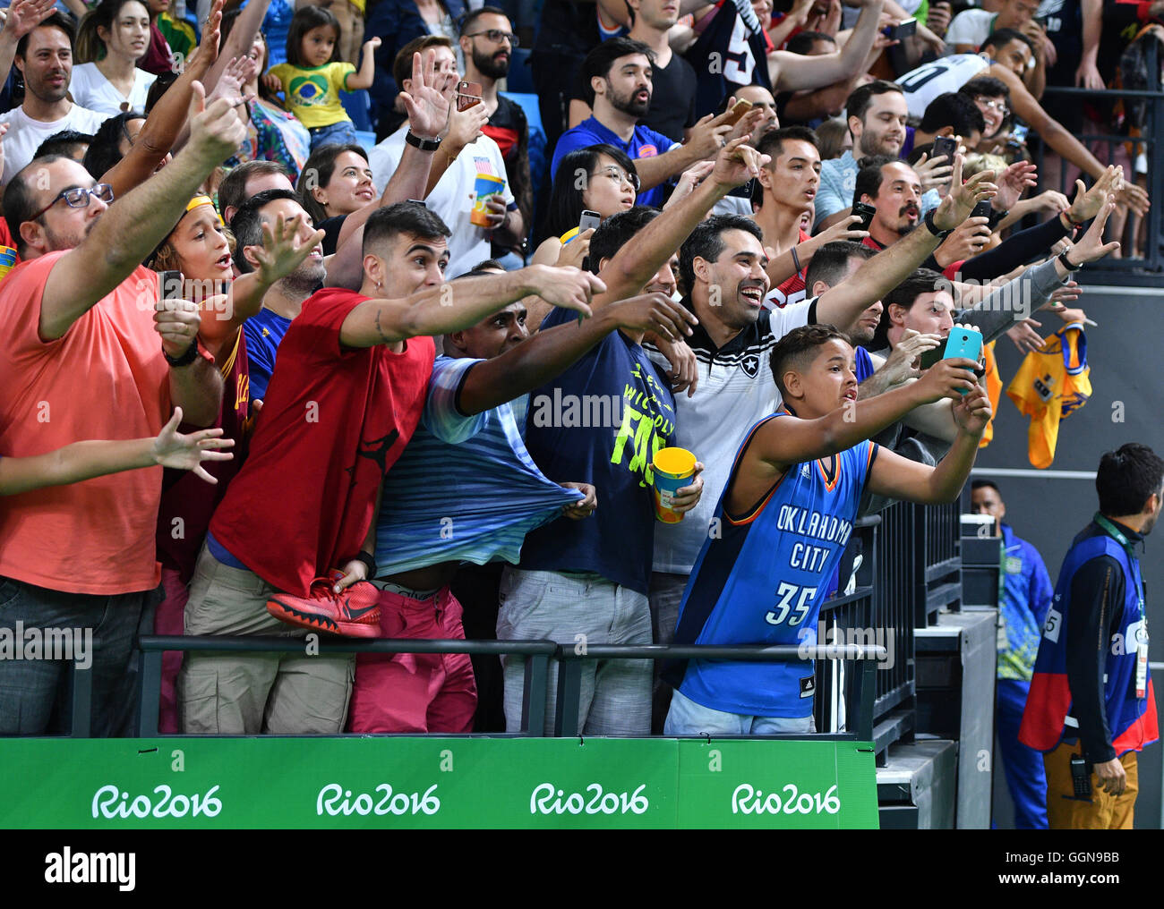 Fans cheer in the stands during the Basketball Men's Preliminary Round ...