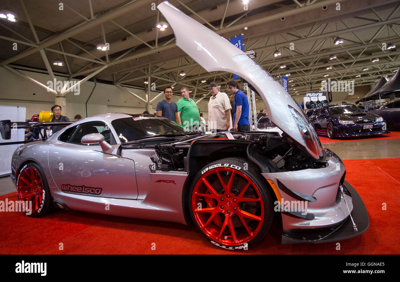 Toronto, Canada. 6th Aug, 2016. Visitors watch a tuned car during the ...