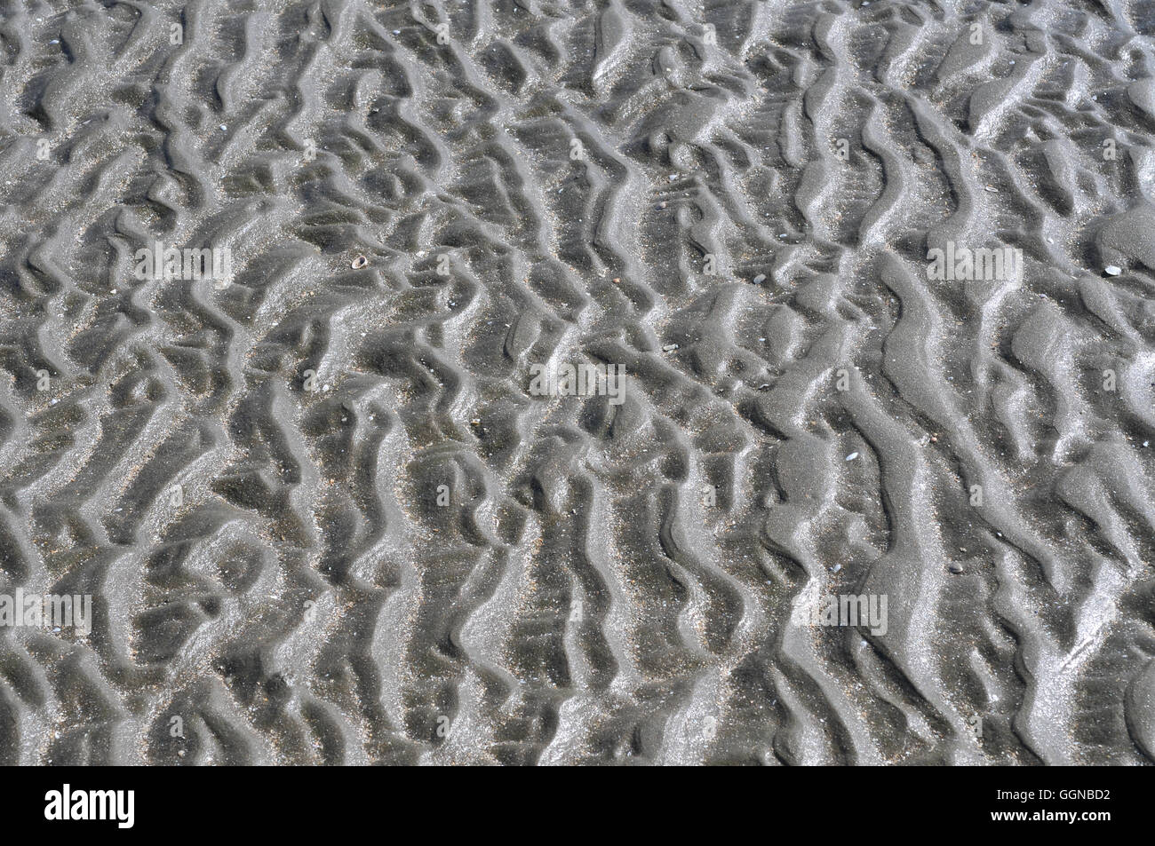 Pattern waves beach sand Stock Photo - Alamy