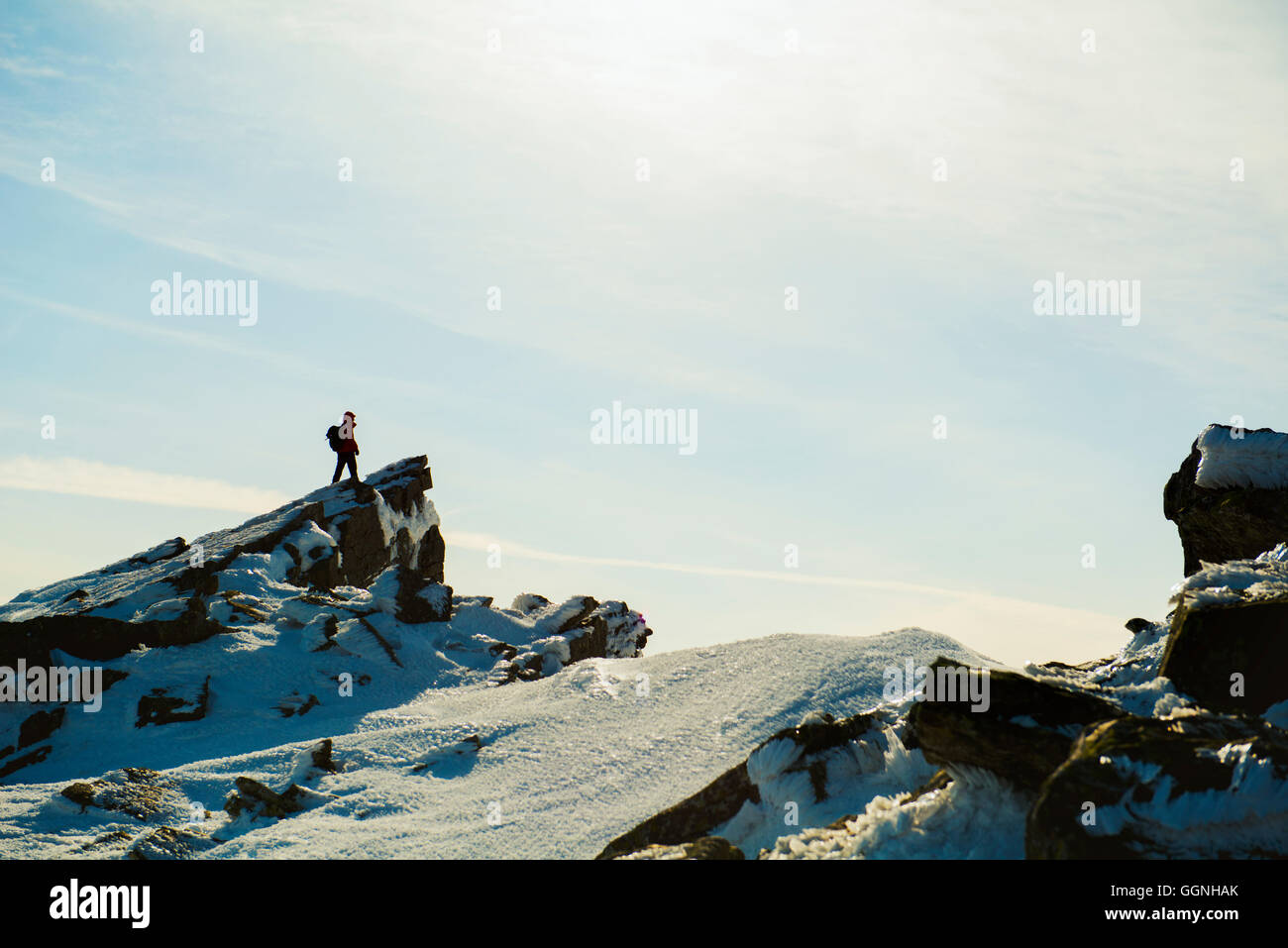 Man hiking on mountain in winter Stock Photo - Alamy