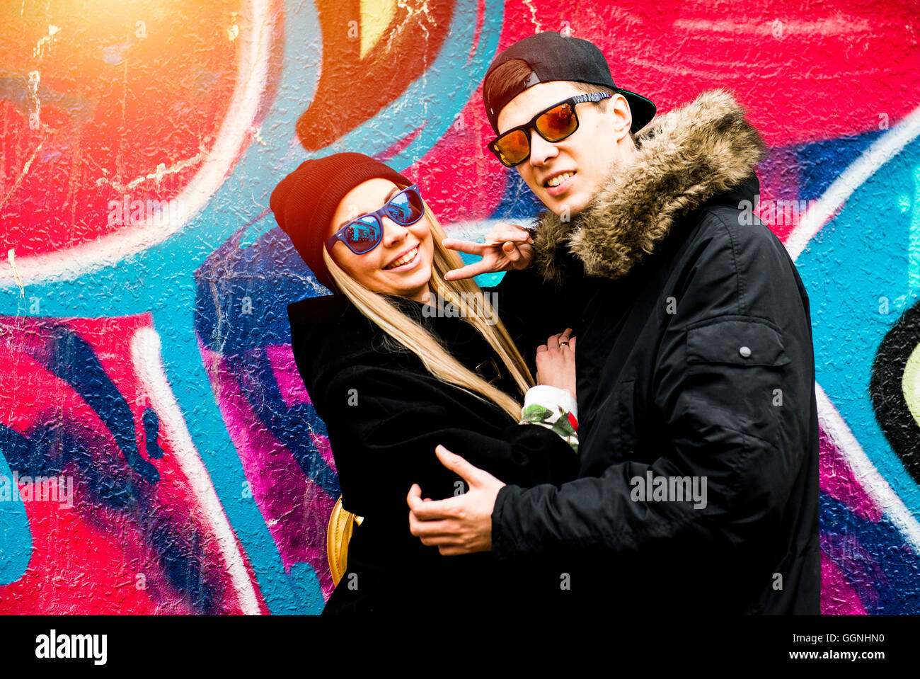 Couple gesturing peace sign hi-res stock photography and images - Alamy