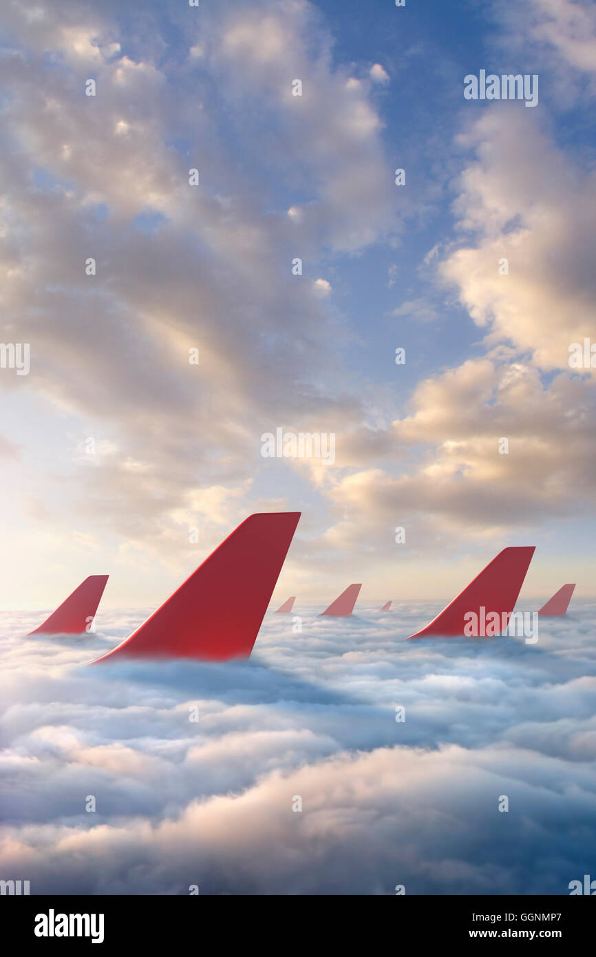 Airplane rudders above clouds Stock Photo - Alamy