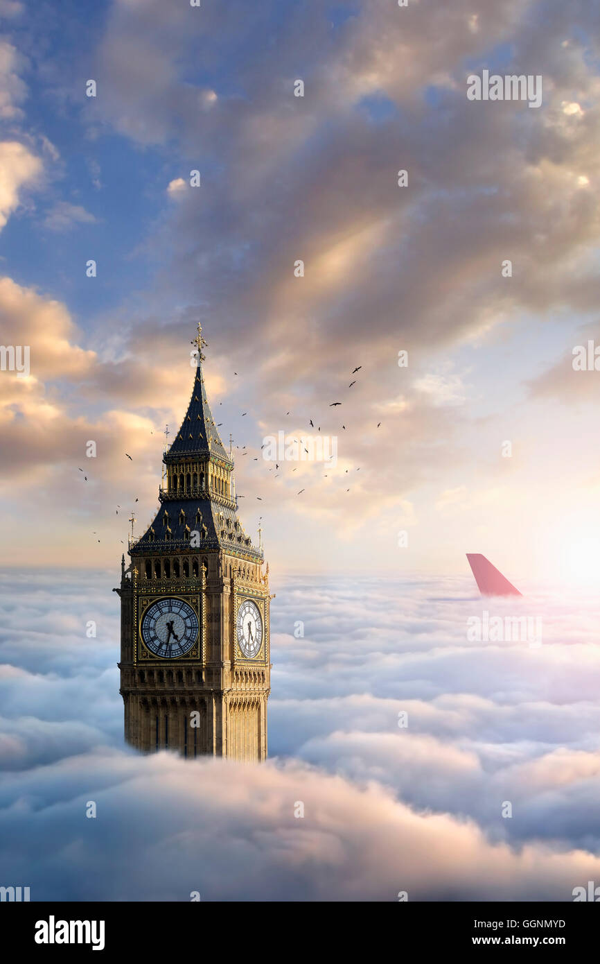 Birds flying around clock tower near airplane rudder above clouds Stock ...
